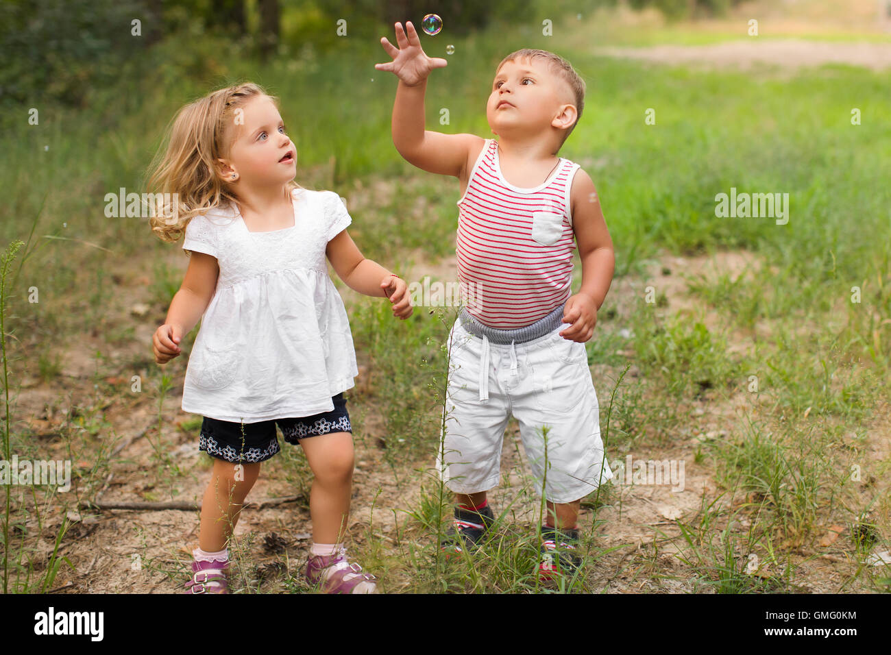 Children playing in the woods hi-res stock photography and images - Alamy