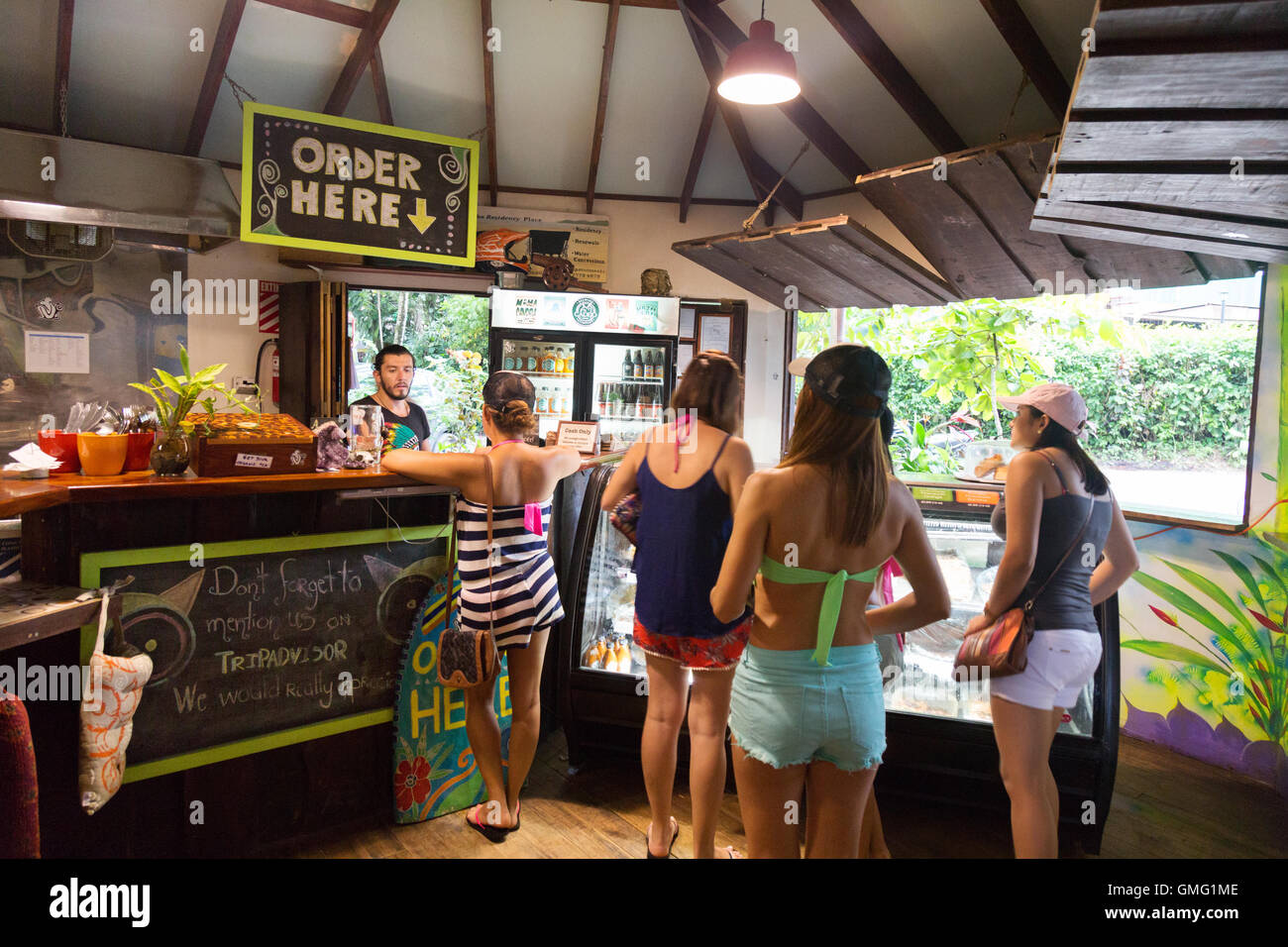 Tourists waiting to be served; Cafe Mono Congo, Dominical, Cost Rica ...