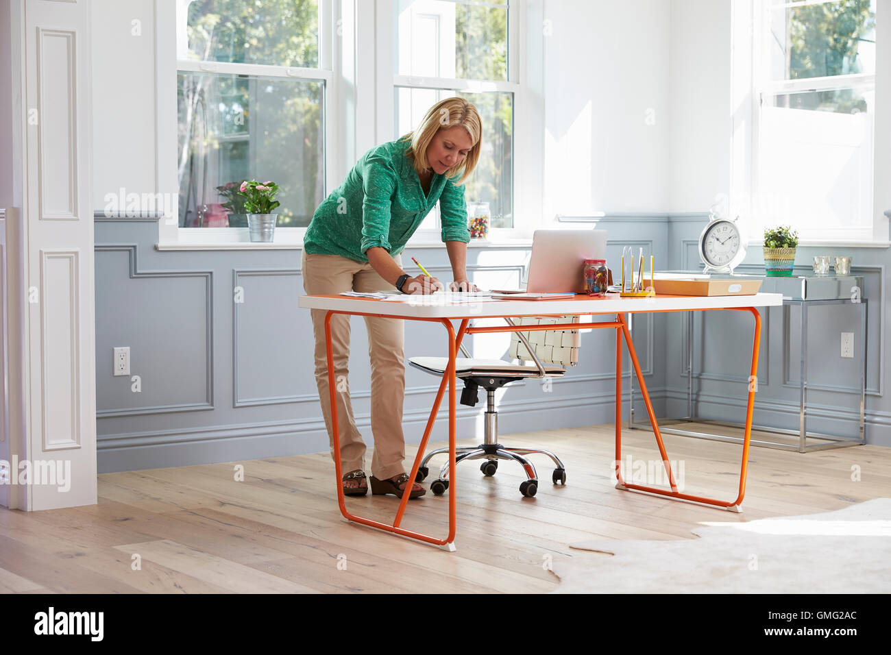 Person standing up from their desk hi-res stock photography and images ...