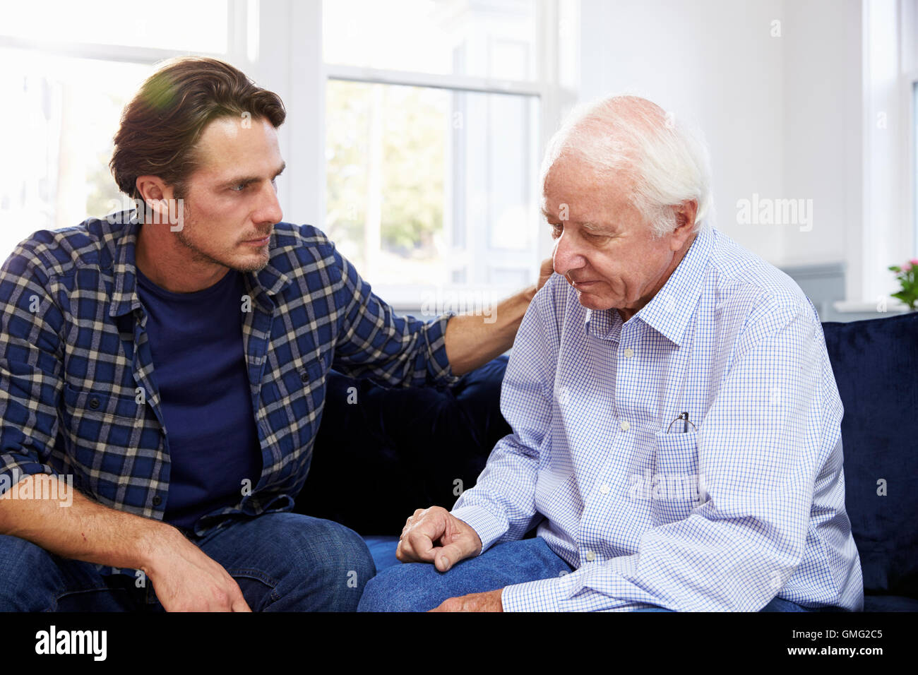 Son consoling sad father home hi-res stock photography and images - Alamy