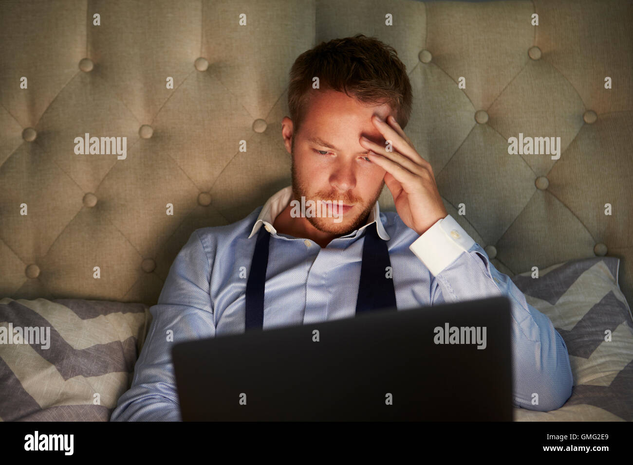Businessman At Home On Bed Working Late On Laptop Stock Photo - Alamy