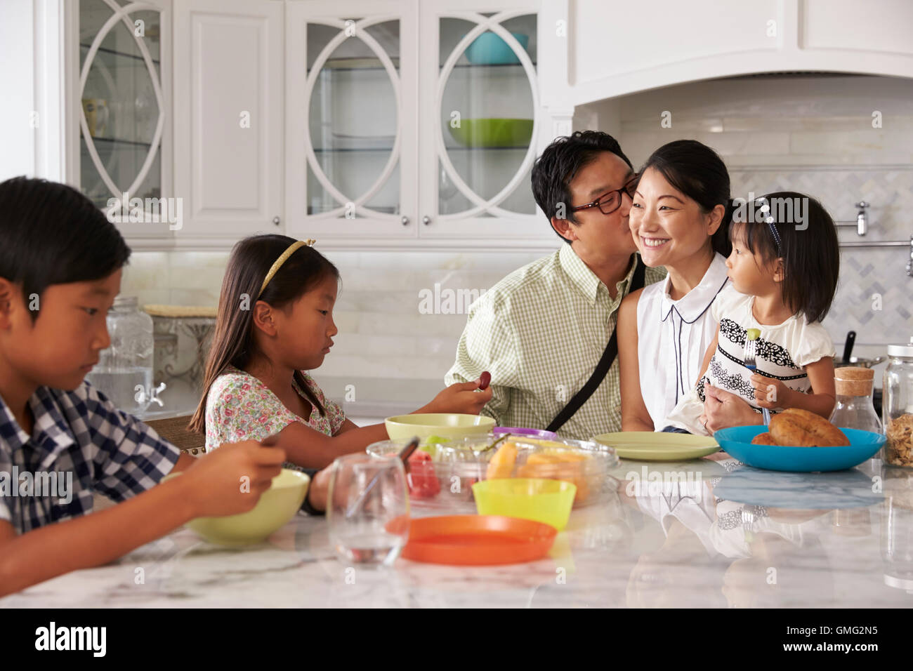 Father Leaving For Work After Family Breakfast In Kitchen Stock Photo ...