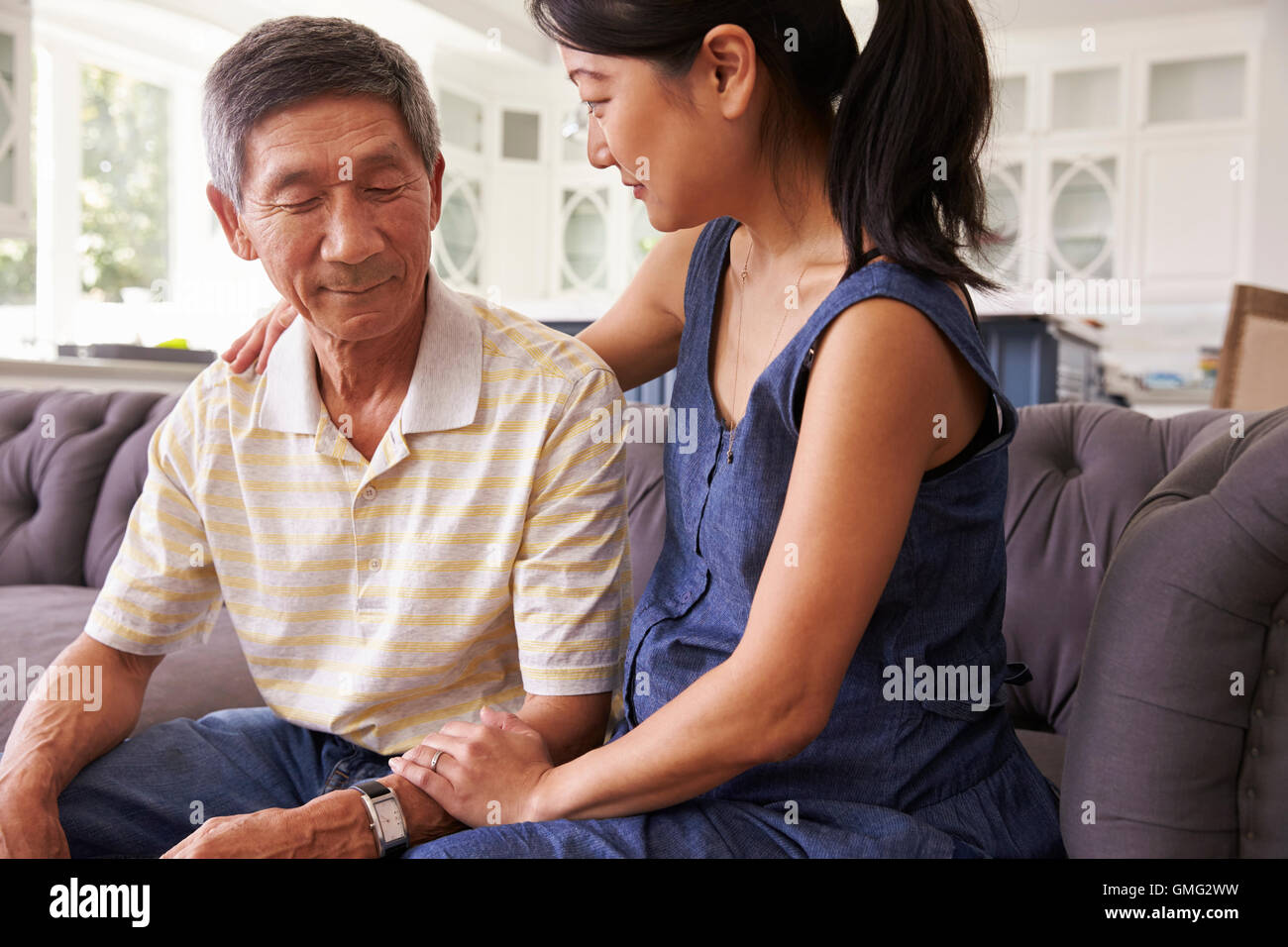 Adult Daughter Talking To Depressed Father At Home Stock Photo - Alamy