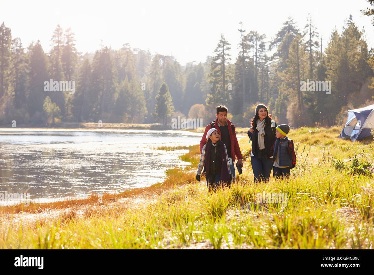 Family on camping trip walk near lake hi-res stock photography and ...