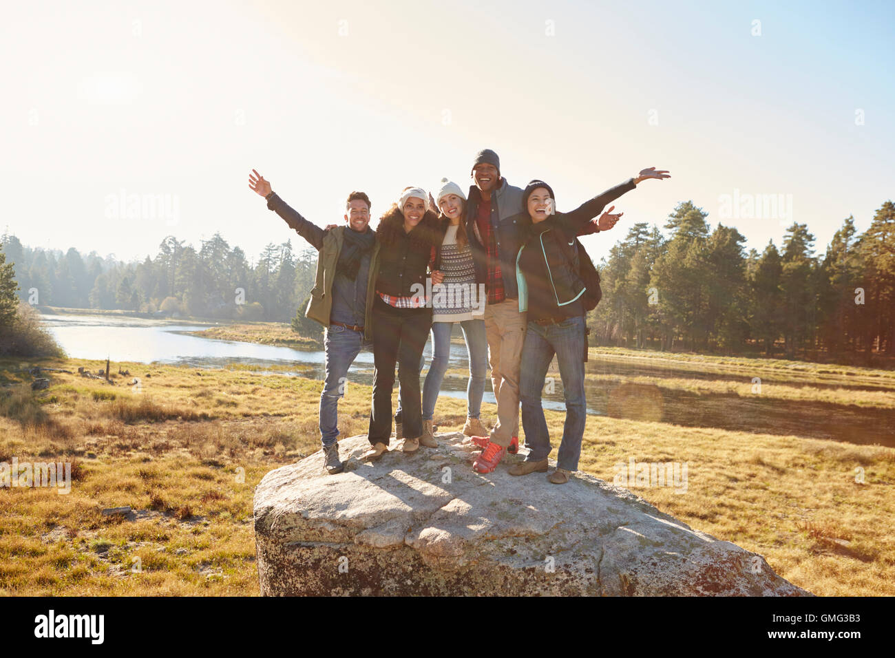 Portrait of five friends standing on a rock in countryside Stock Photo ...