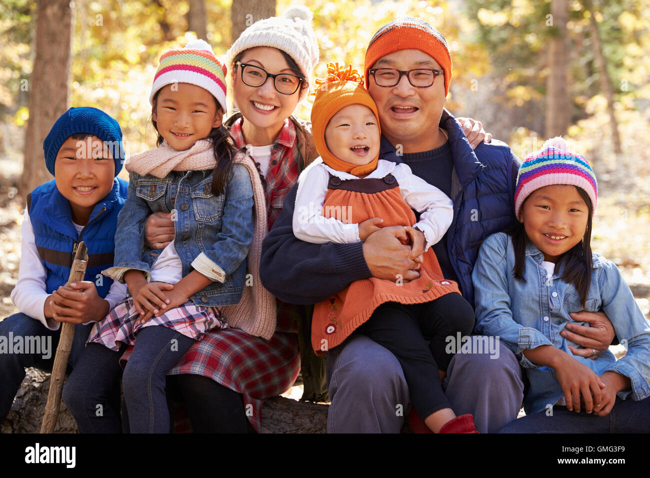 Portrait of Asian parents and four kids in a forest Stock Photo - Alamy
