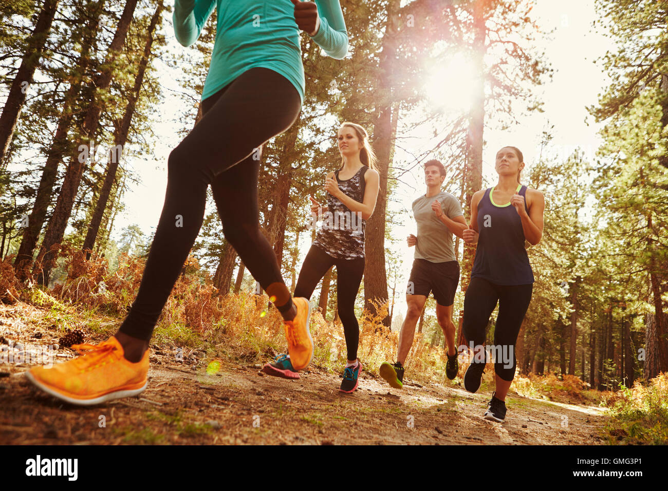 Running group four adults hi-res stock photography and images - Alamy