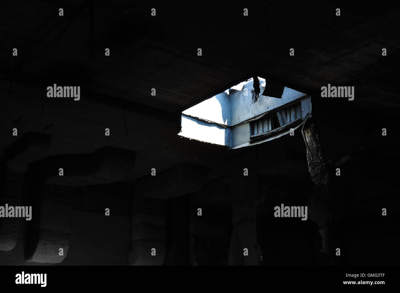 Ceiling skylight in dark abandoned factory interior. Industrial decay ...