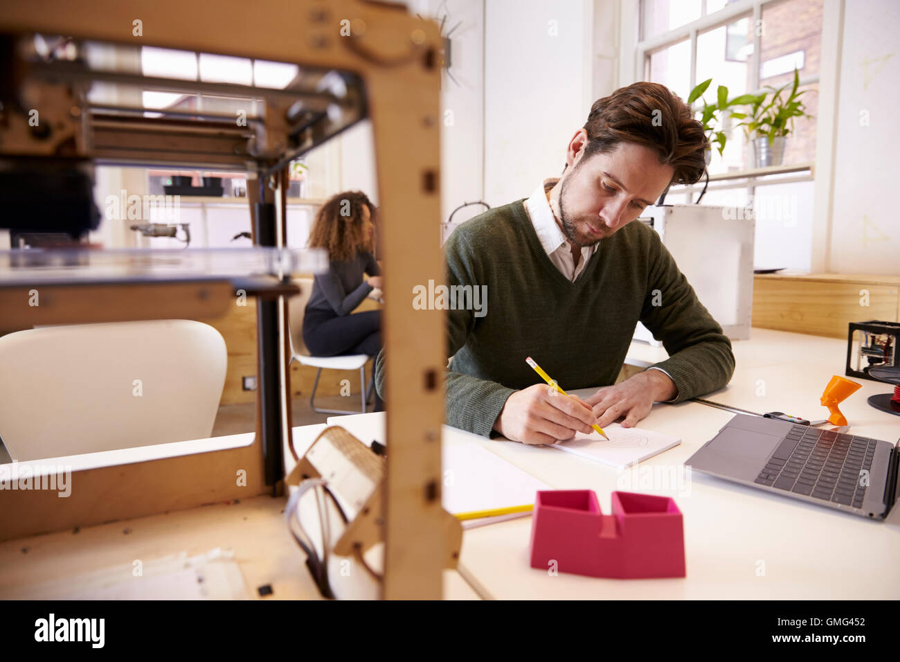 Designer Drawing Sketch In 3D Design Studio Stock Photo - Alamy
