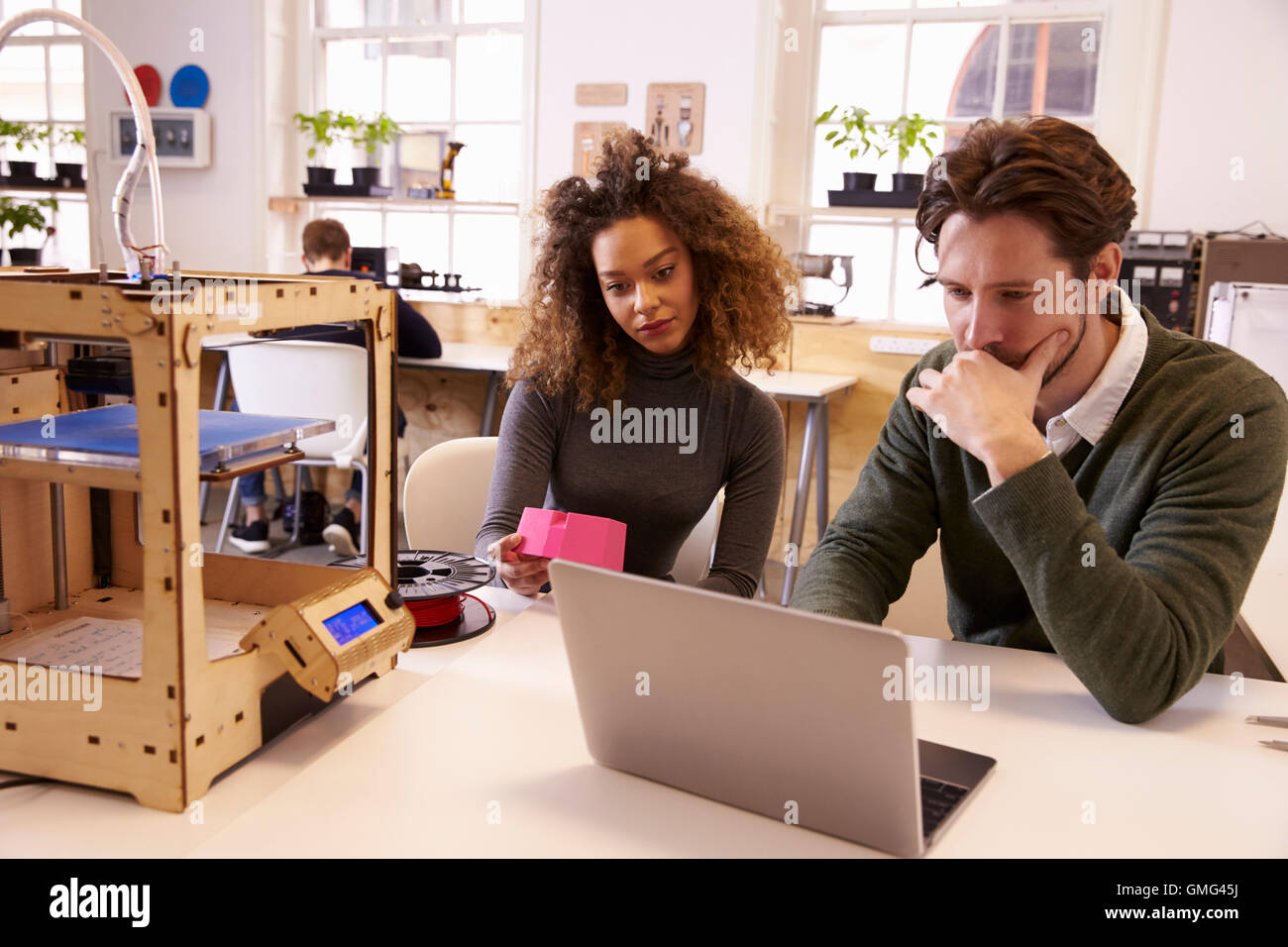 Designers Working With 3D Printer Refining Design Stock Photo - Alamy
