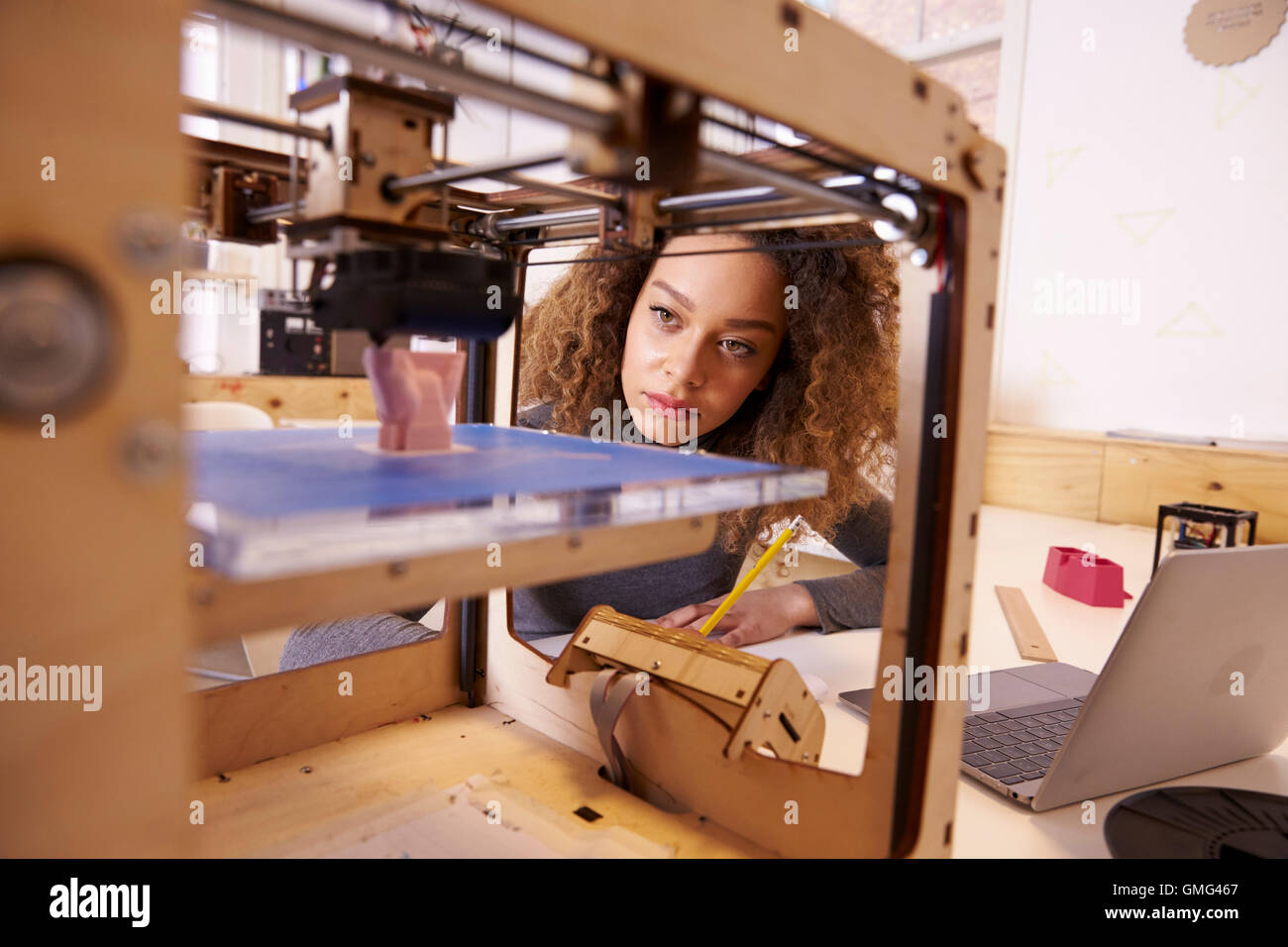 Female Designer Working With 3D Printer In Design Studio Stock Photo ...