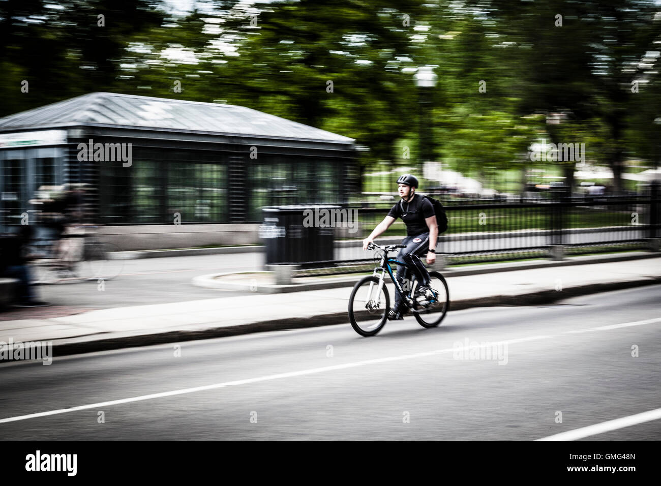 Guy cyclist in the city, Boston Stock Photo - Alamy