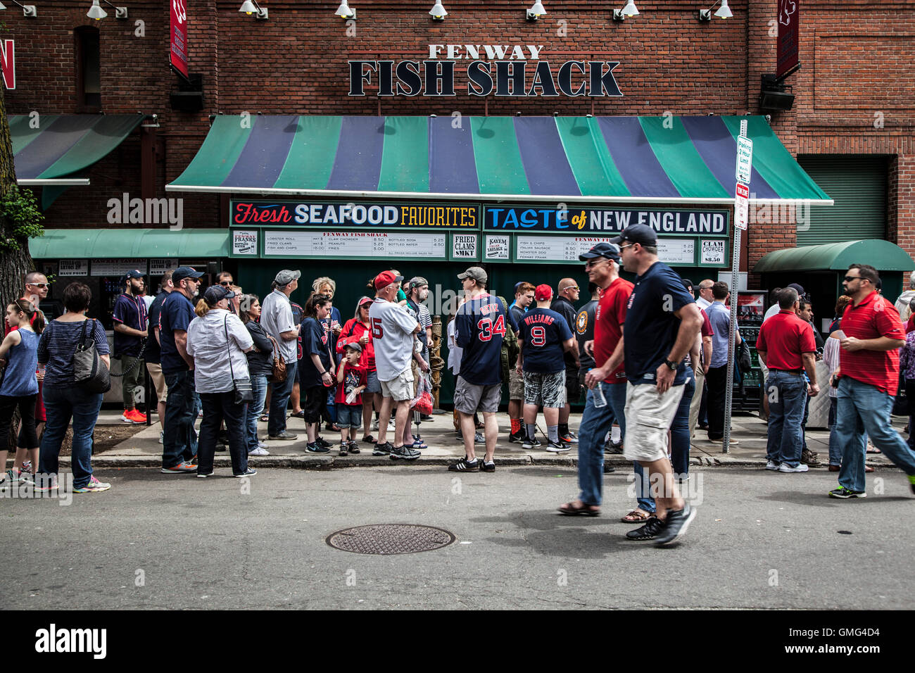 Fans gather on yawkey way at fenway park hi-res stock photography and ...