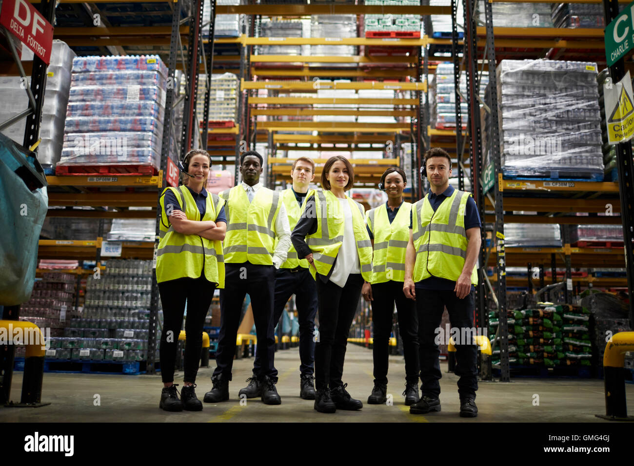 Group portrait of staff at distribution warehouse, low angle Stock ...