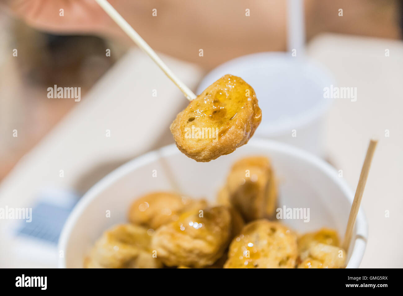 Hand Holding Meatball on Toothpick Stock Photo - Alamy