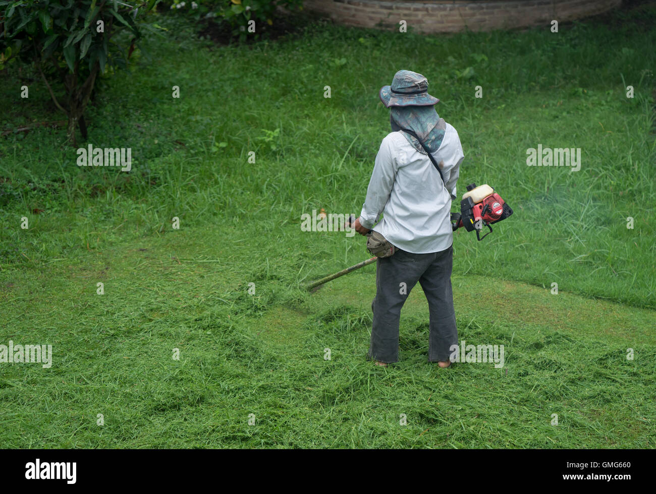 Man working grass trimmer hi-res stock photography and images - Alamy