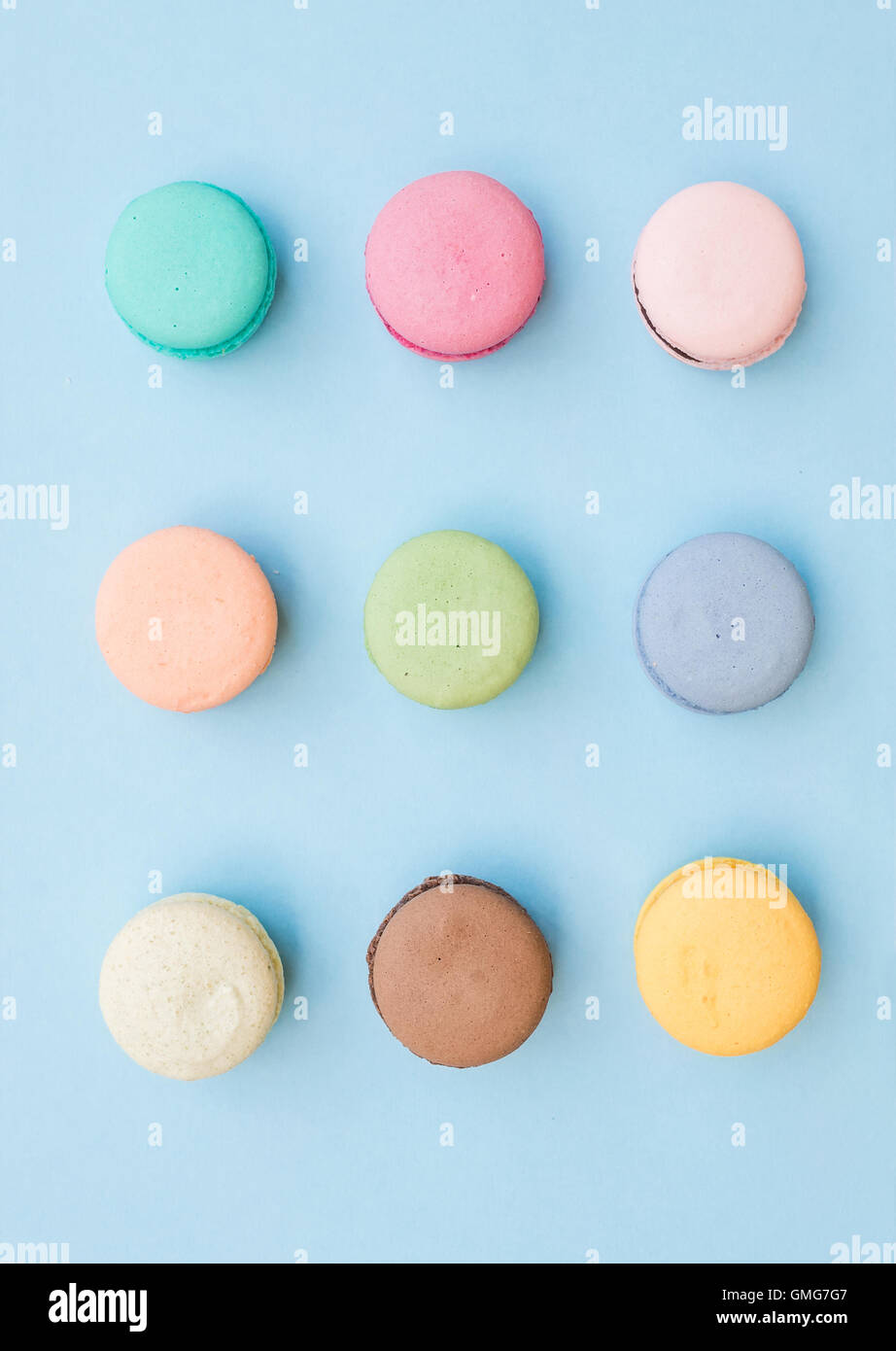 Sweet colorful French macaroon biscuits on pastel blue background Stock ...