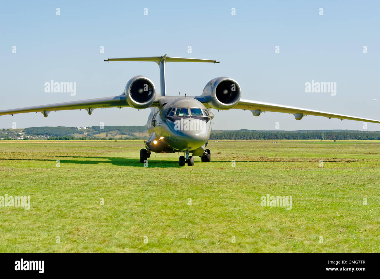Light military-transport jet An-72 at the airfield in a bright sunny ...