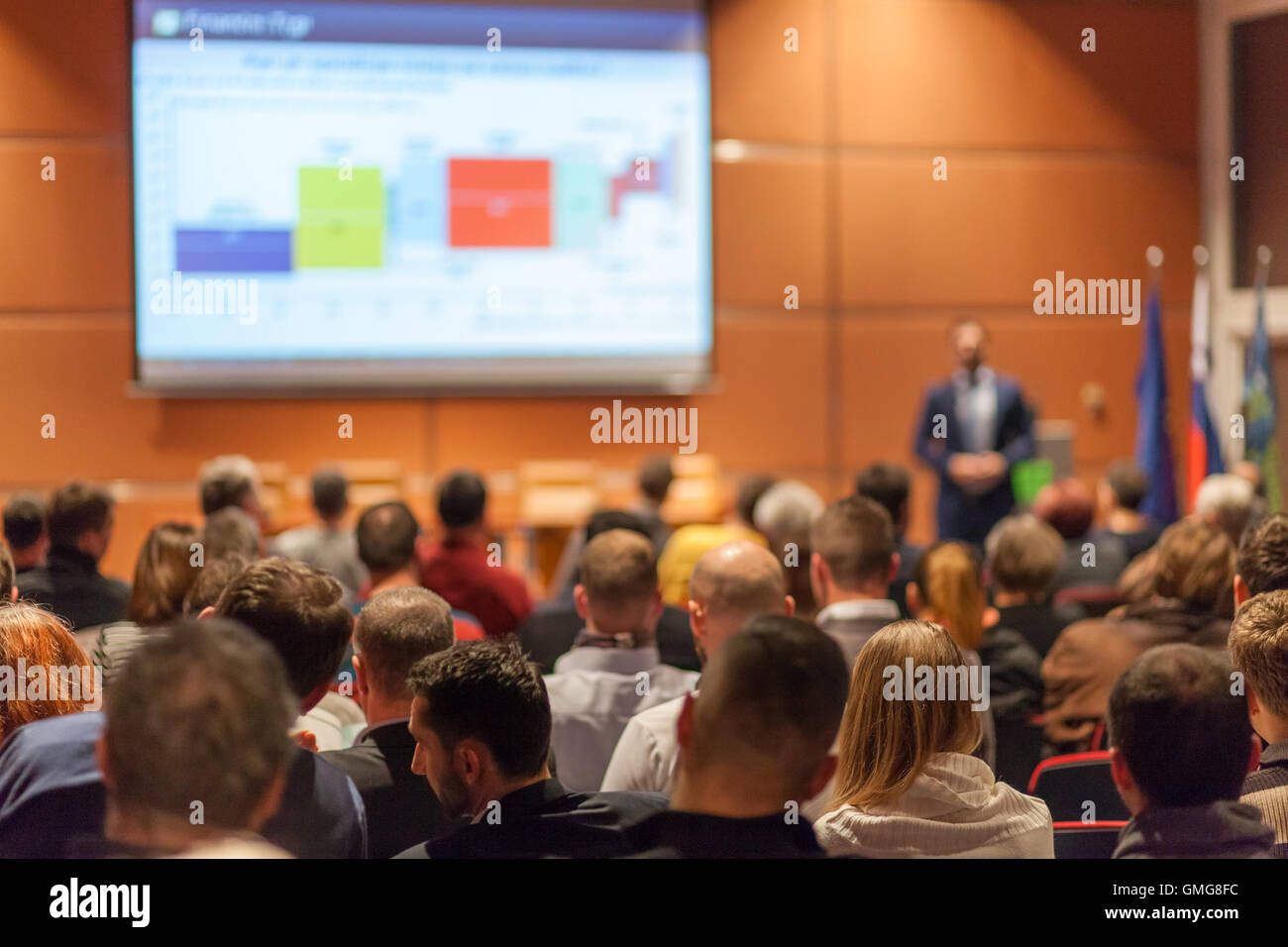 Business speaker giving a talk in conference hall Stock Photo - Alamy