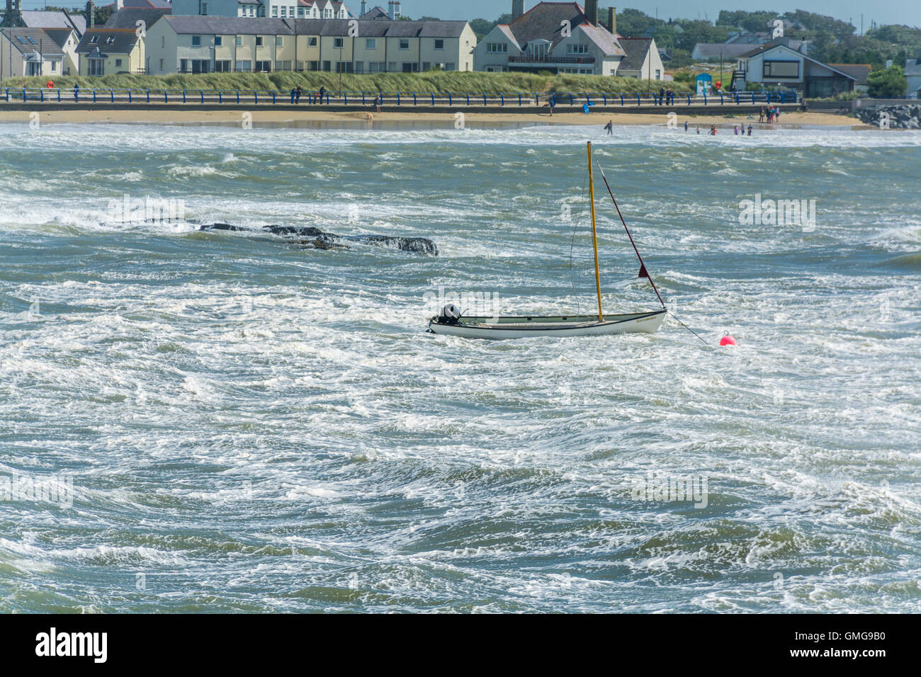 Small boat in rough seas at Trearddur Bay Stock Photo - Alamy