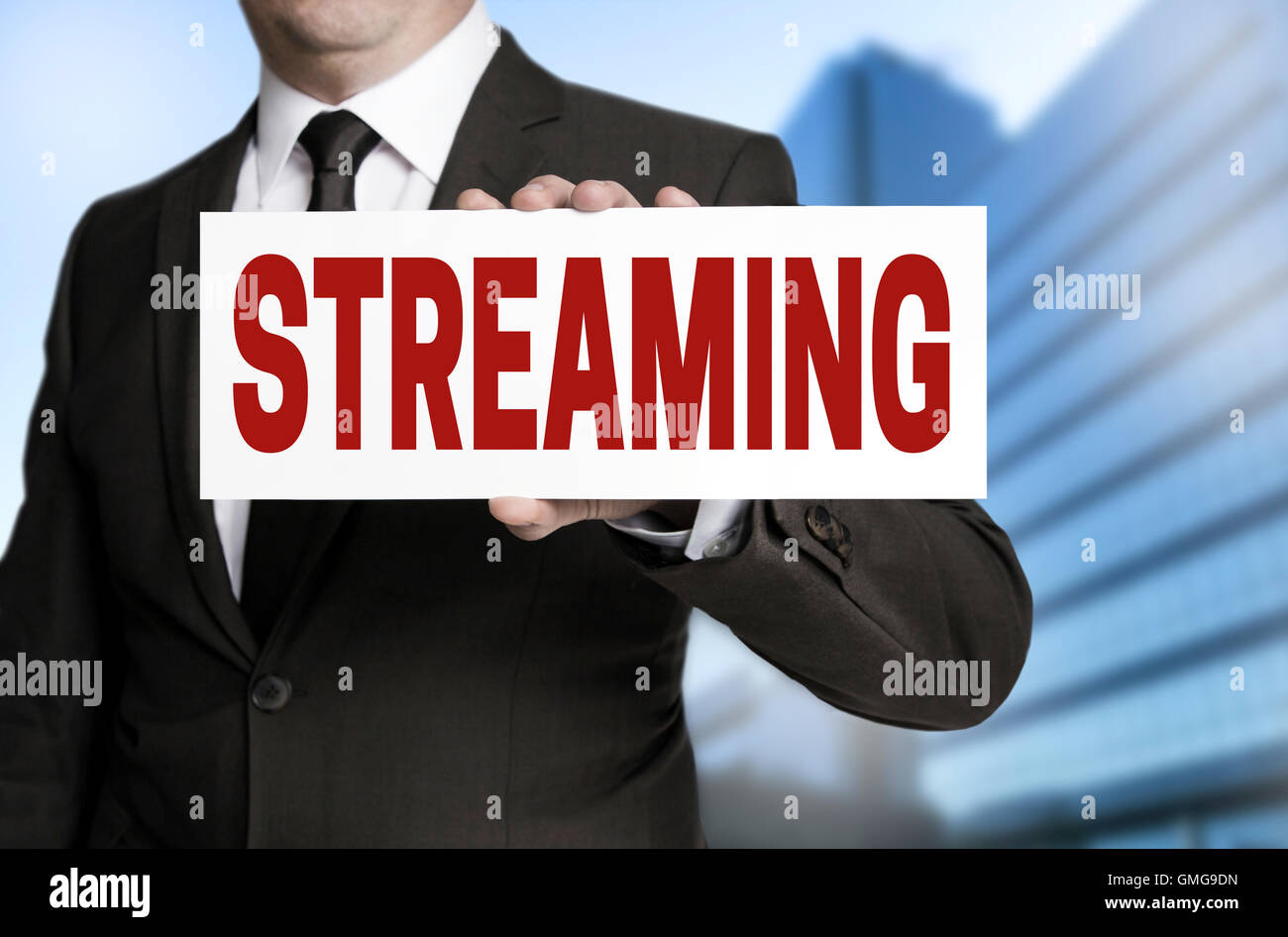 Streaming sign is held by businessman Stock Photo - Alamy