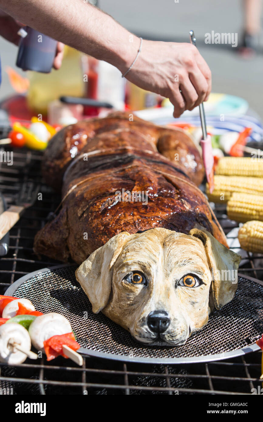 London, UK. 26 August 2016. Animal rights supporters PETA roast a "dog ...