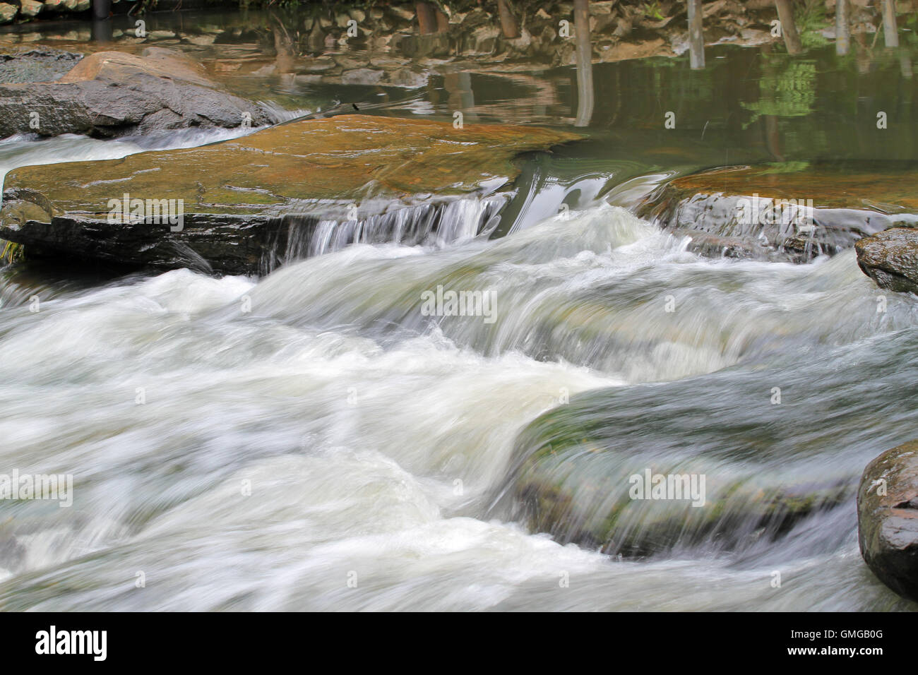 waterfall flow over stone in the river Stock Photo - Alamy