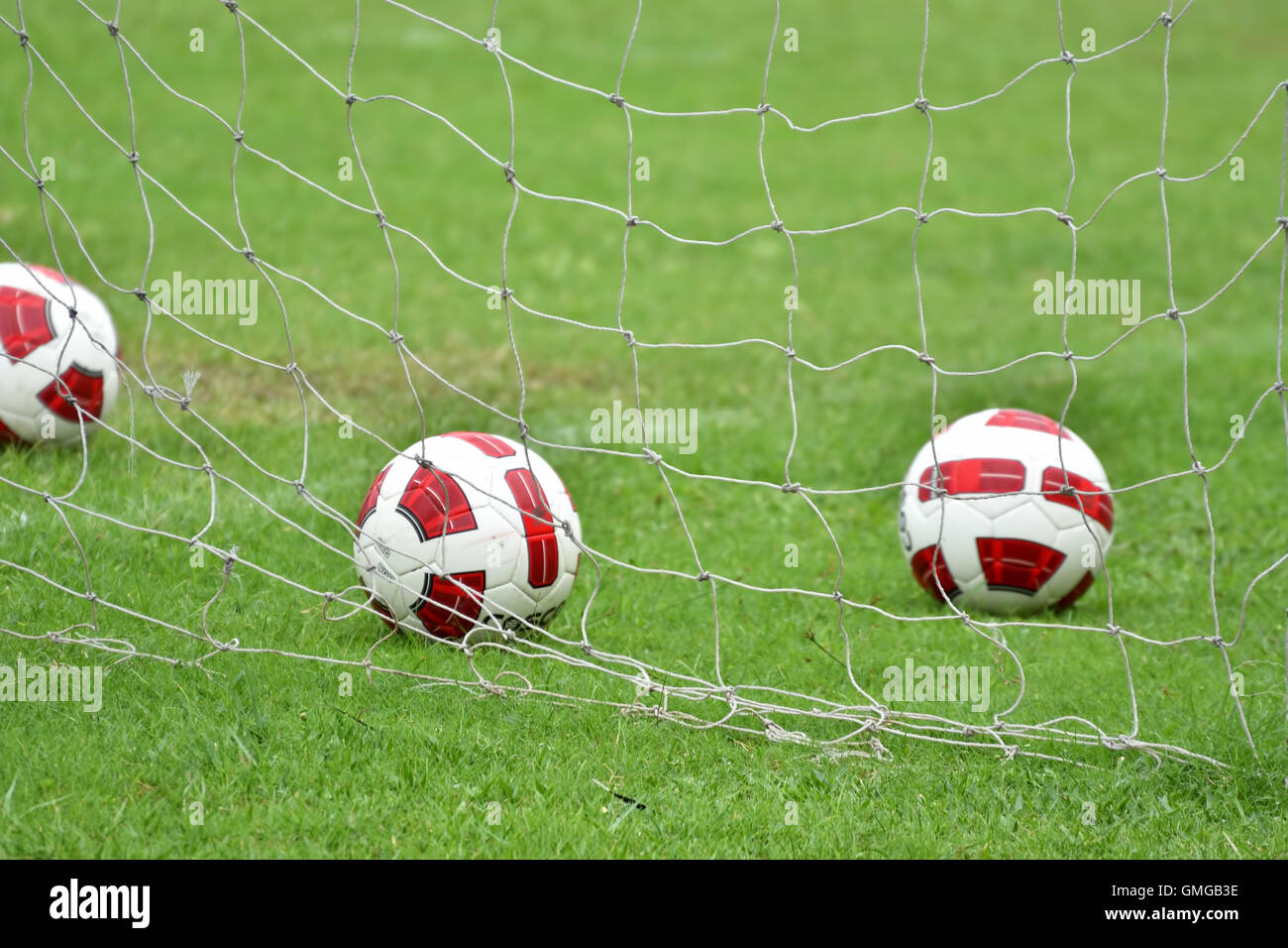 Soccer ball in a empty goal Stock Photo - Alamy