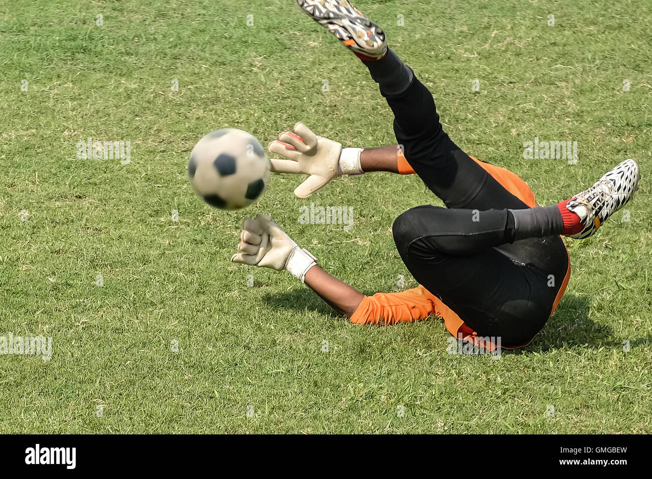 In play soccer goalkeeper try to catch a ball Stock Photo - Alamy