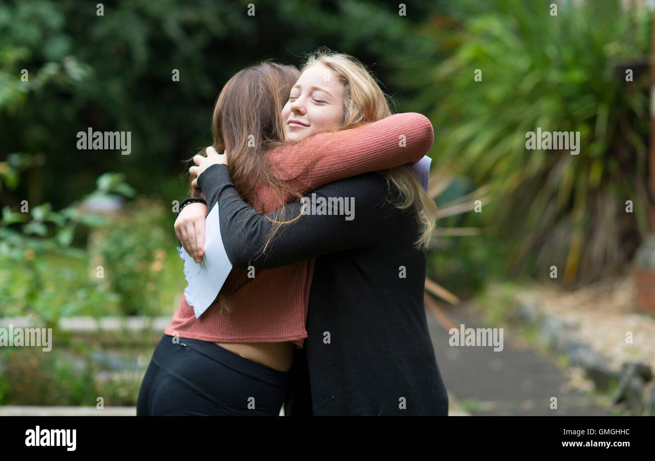 Two female girls celebrate their GCSE exam results at a school in ...