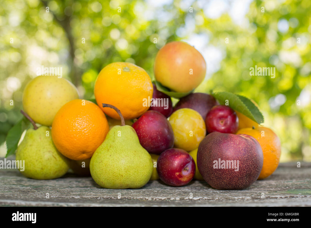 fruits in wooden table, outdoor Stock Photo - Alamy