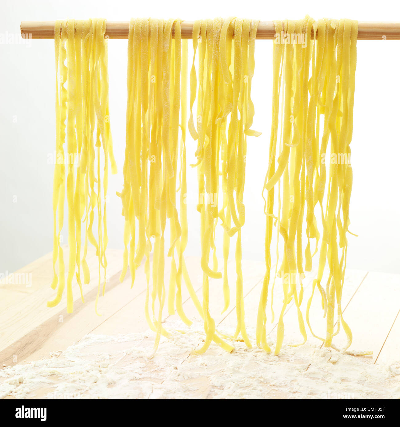 Drying pasta on a stick Stock Photo - Alamy