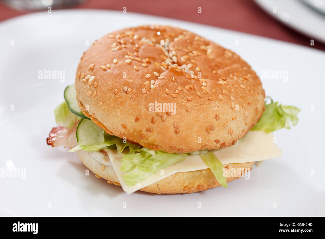 cheeseburger on the white plate Stock Photo - Alamy