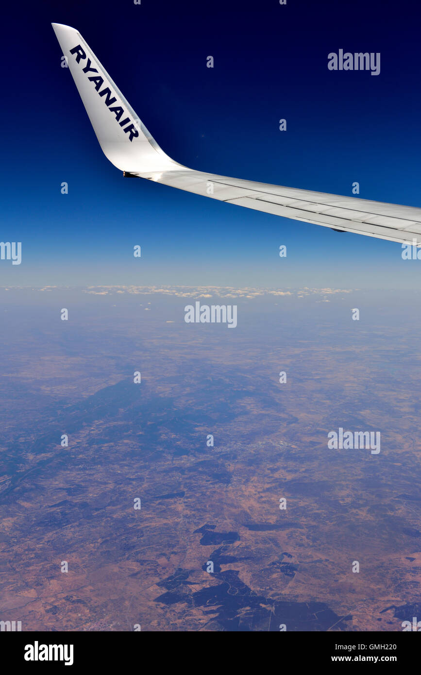 Ryanair plane wing-tip flying over southern Portugal Stock Photo - Alamy