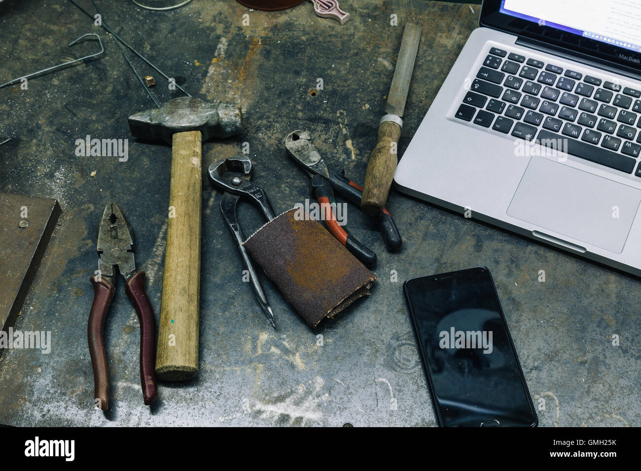 Top view of old tools,laptop and phone on table Stock Photo - Alamy