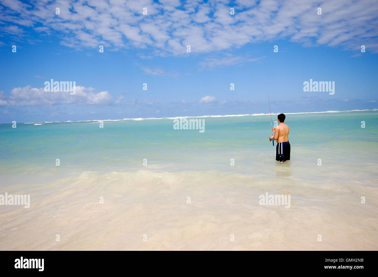 Fishing on beach Stock Photo - Alamy