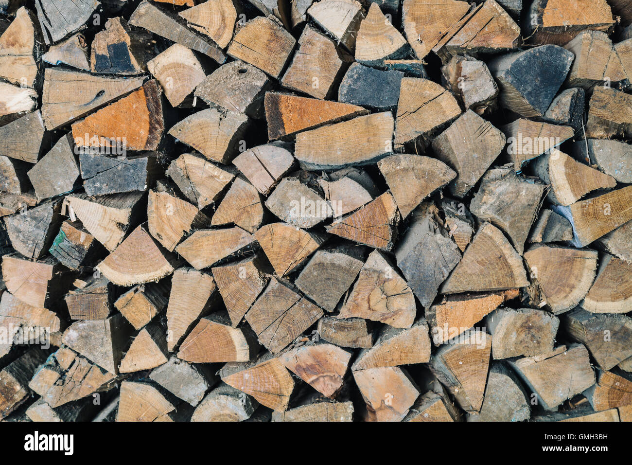 Stack of dry firewoods indoor Stock Photo - Alamy