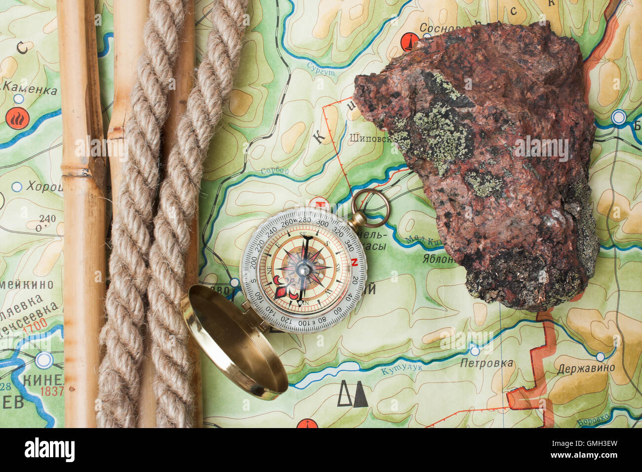 Compass with a rope Stock Photo - Alamy