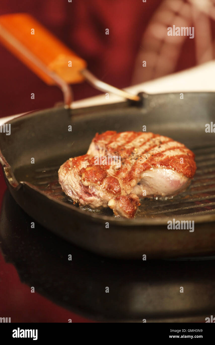 Meat frayed on fraying pan Stock Photo - Alamy