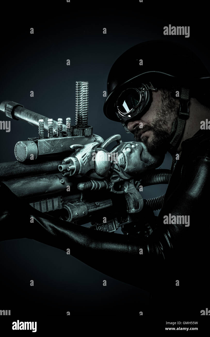 soldier of the future with huge laser gun and cannon, pointing Stock ...
