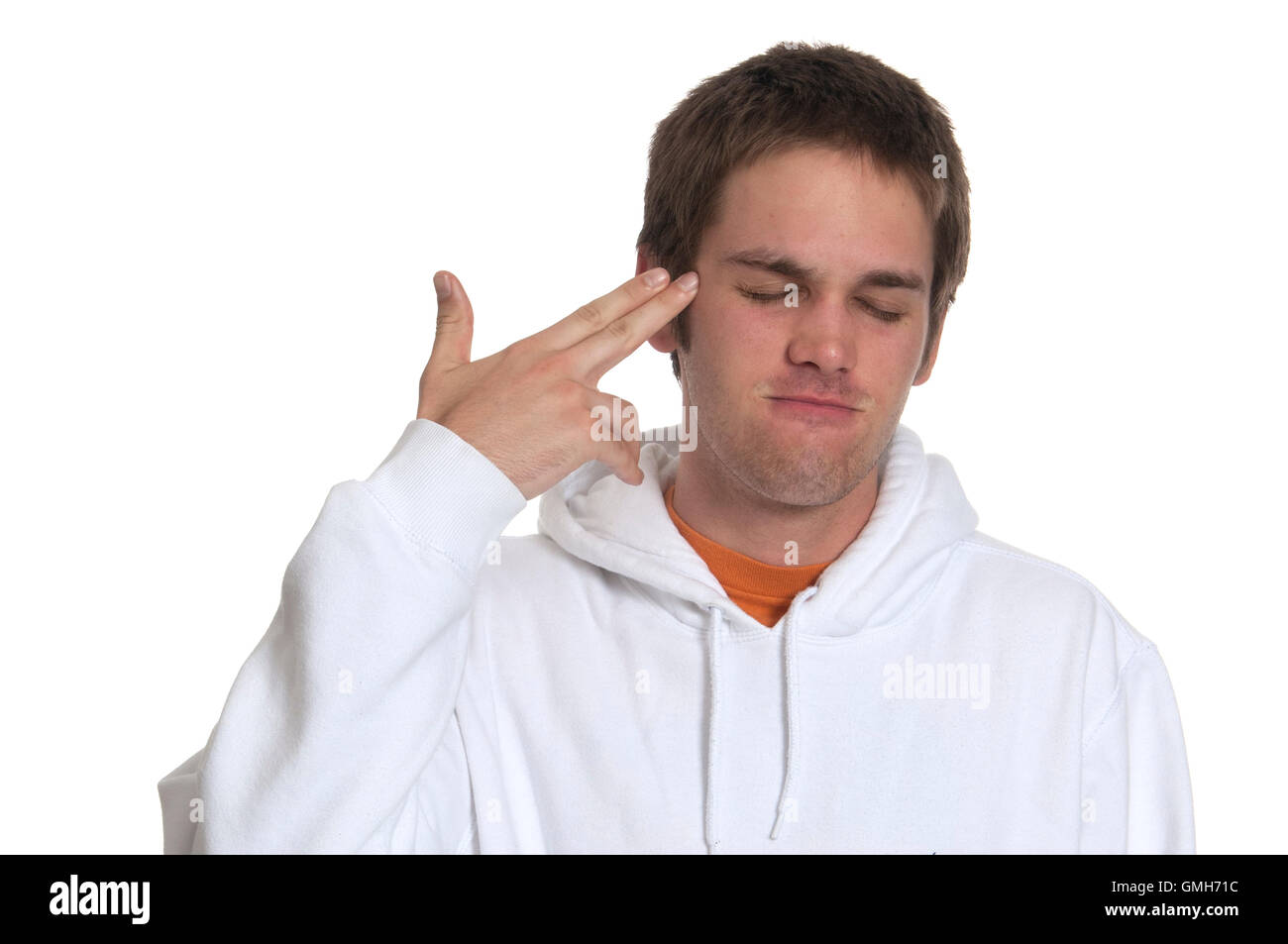 teenage boy pointing to head Stock Photo - Alamy