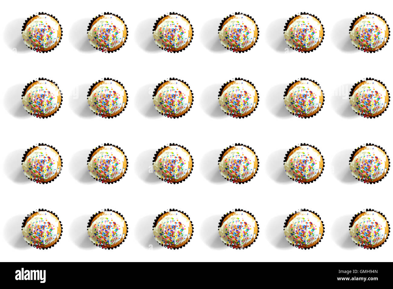 A large grid of cupcakes with icing and hundreds and thousands ...