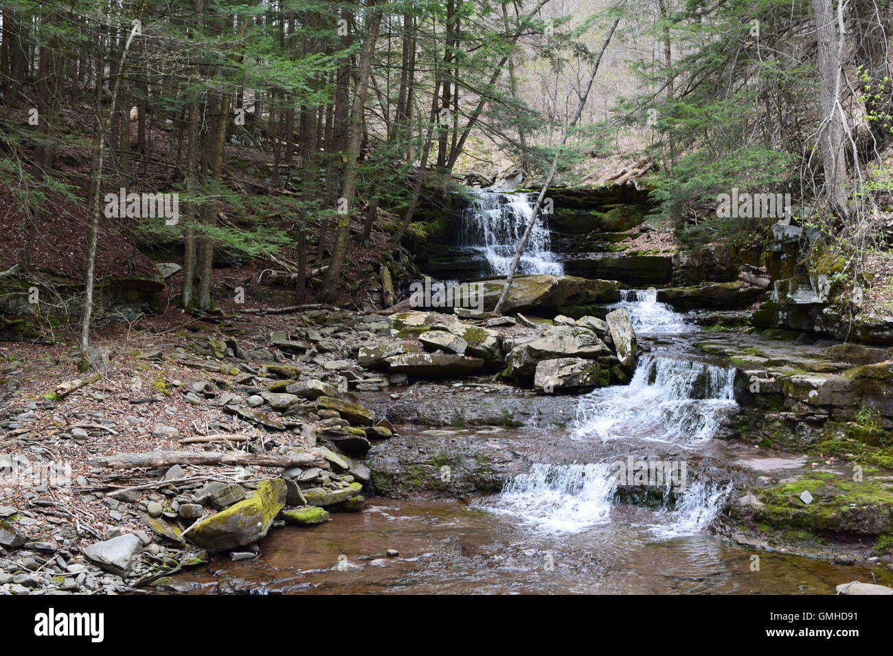 A Waterfall with many layers leading into a Stream Stock Photo - Alamy