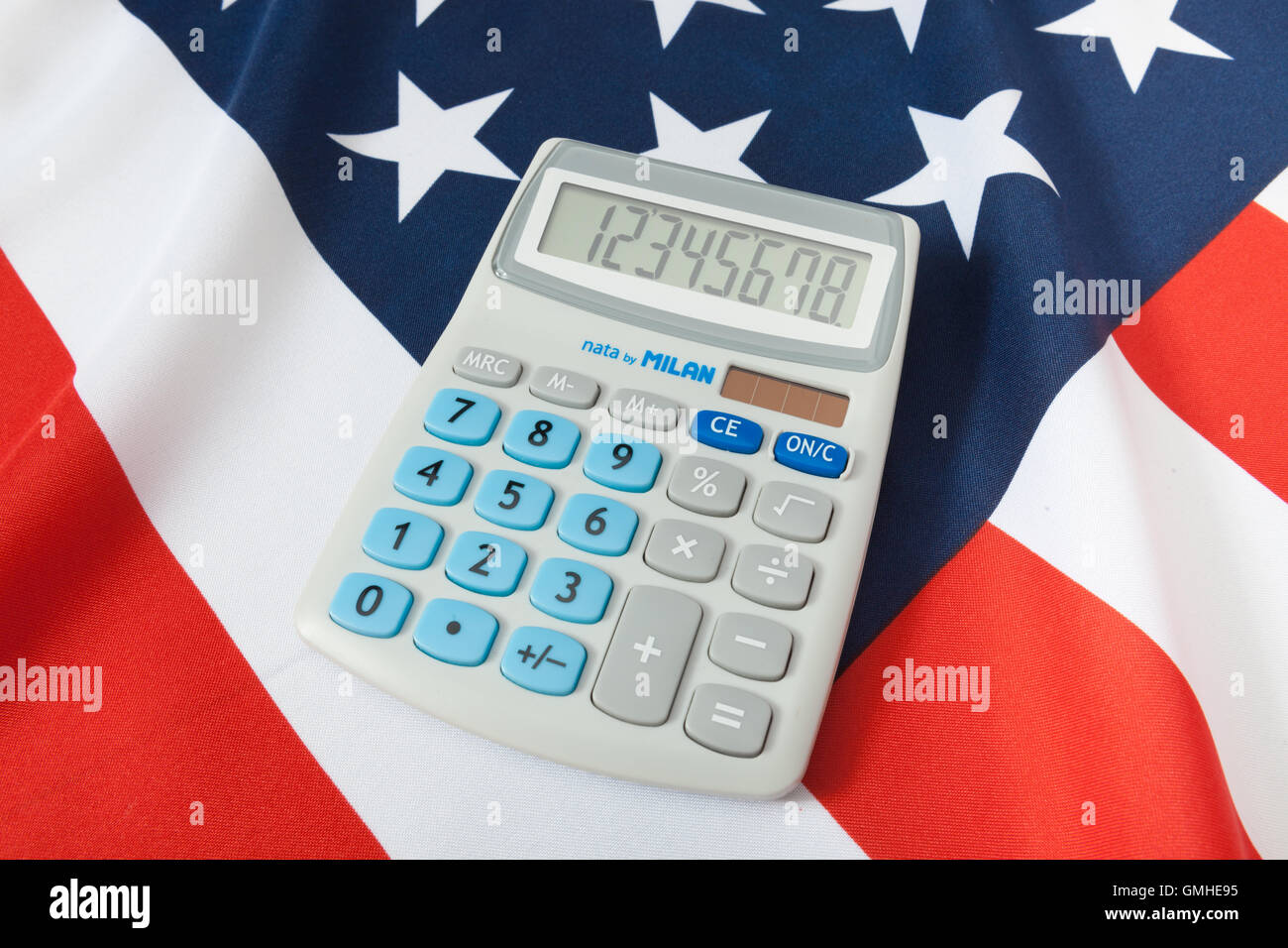 Part of studio shoot ruffled national flag with calculator over it ...