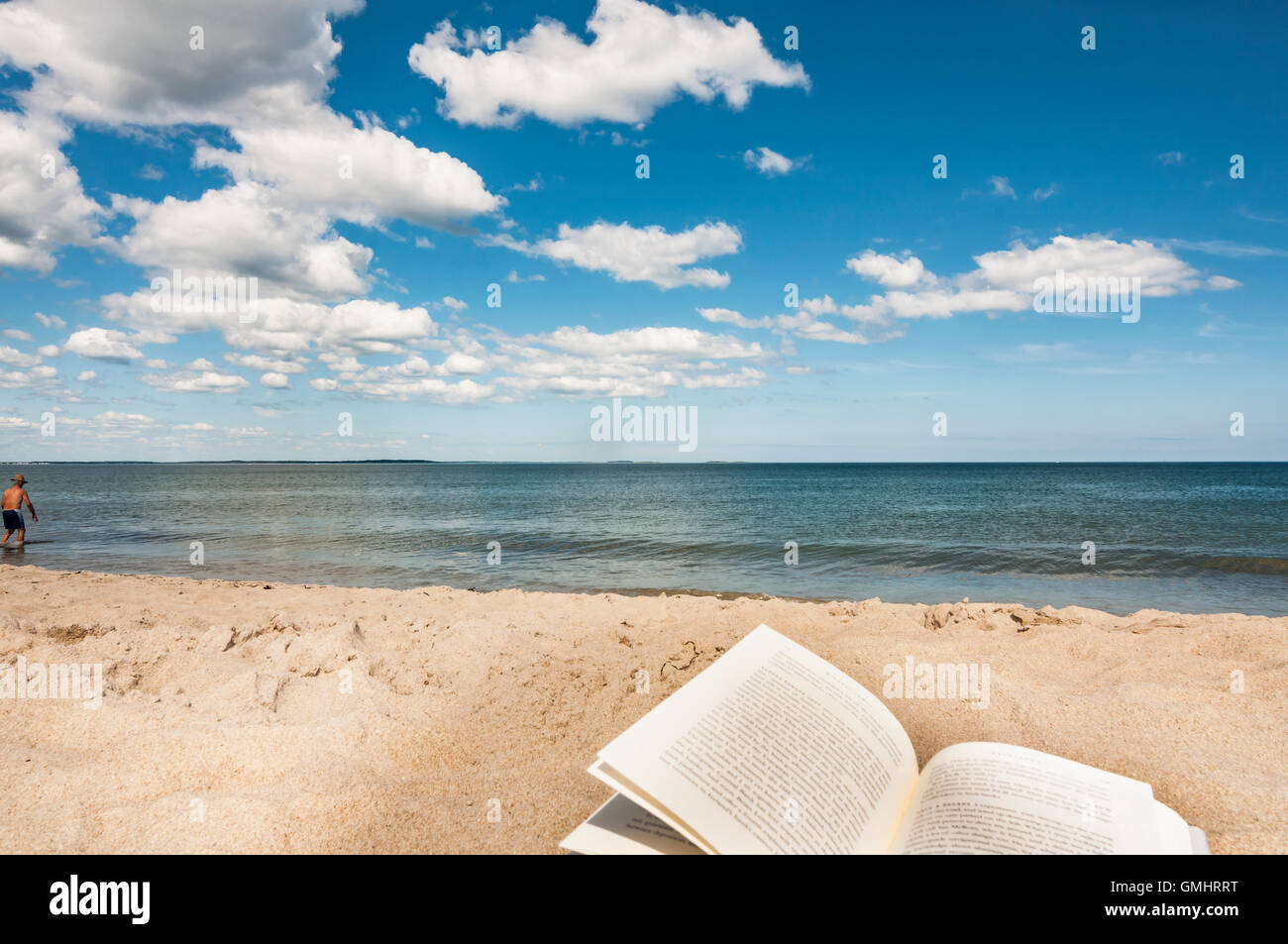 Book on the ocean beach in New England Stock Photo - Alamy