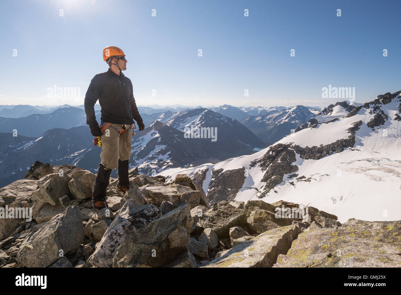 A mountain climber poses for a picture Stock Photo - Alamy