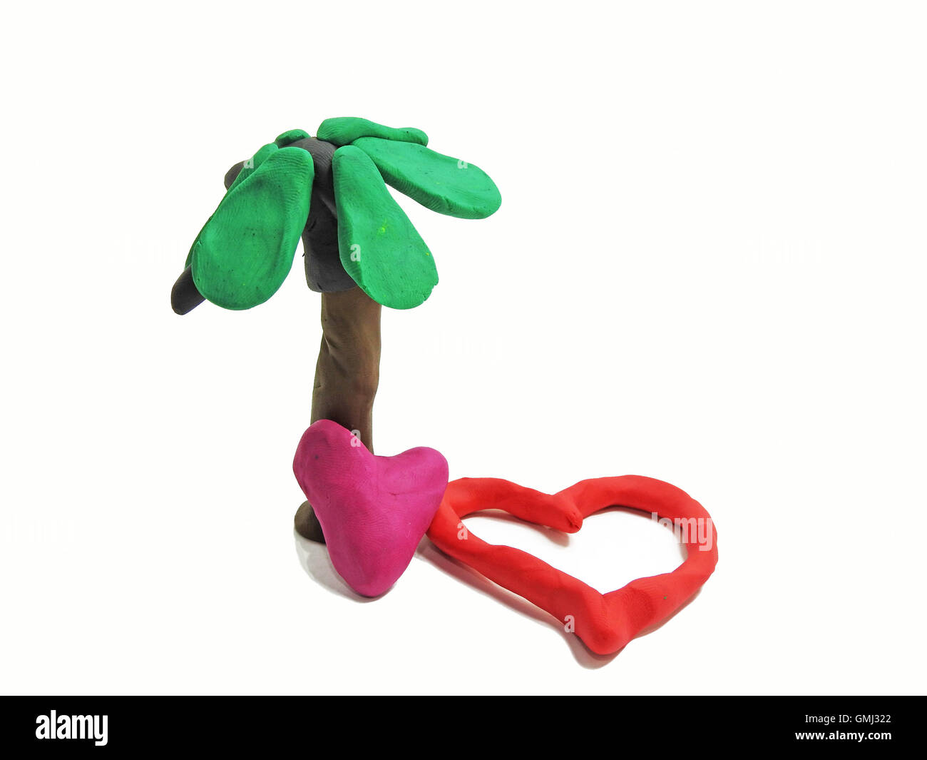 Two red hearths made from plasticine Stock Photo - Alamy