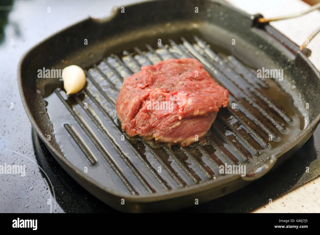 Meat frayed on fraying pan Stock Photo - Alamy
