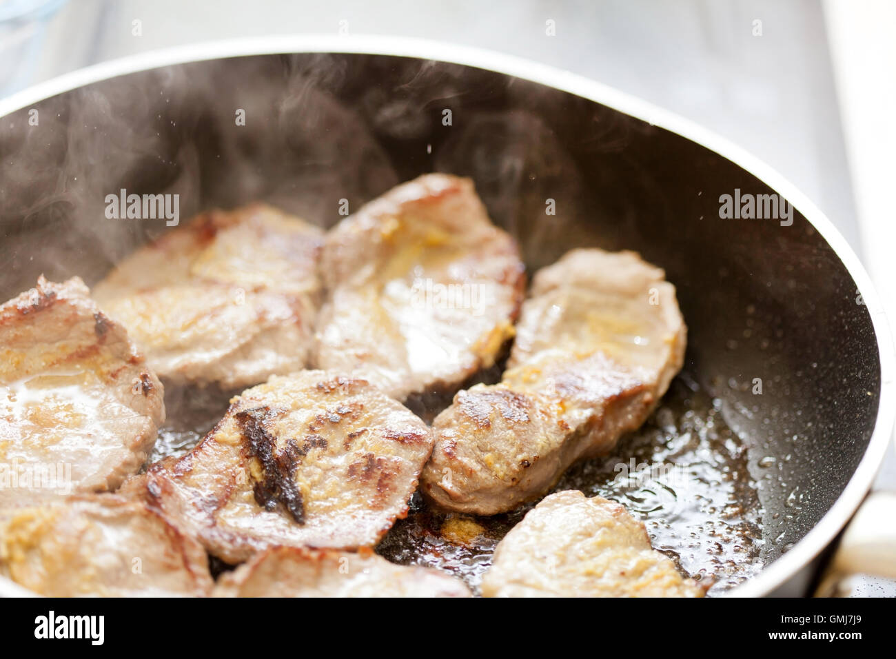 Meat frayed on fraying pan Stock Photo - Alamy