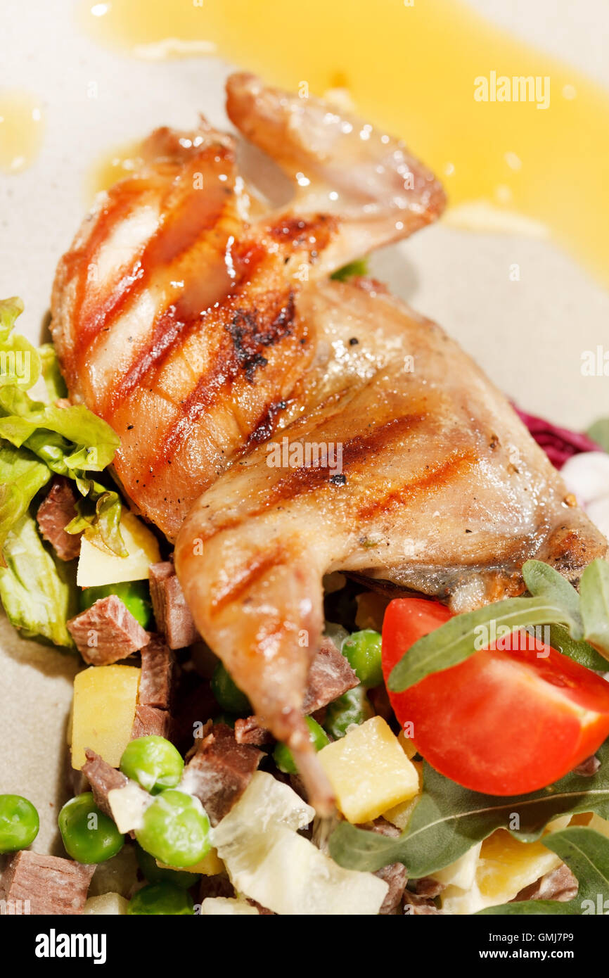 quail on the meat salad Stock Photo - Alamy